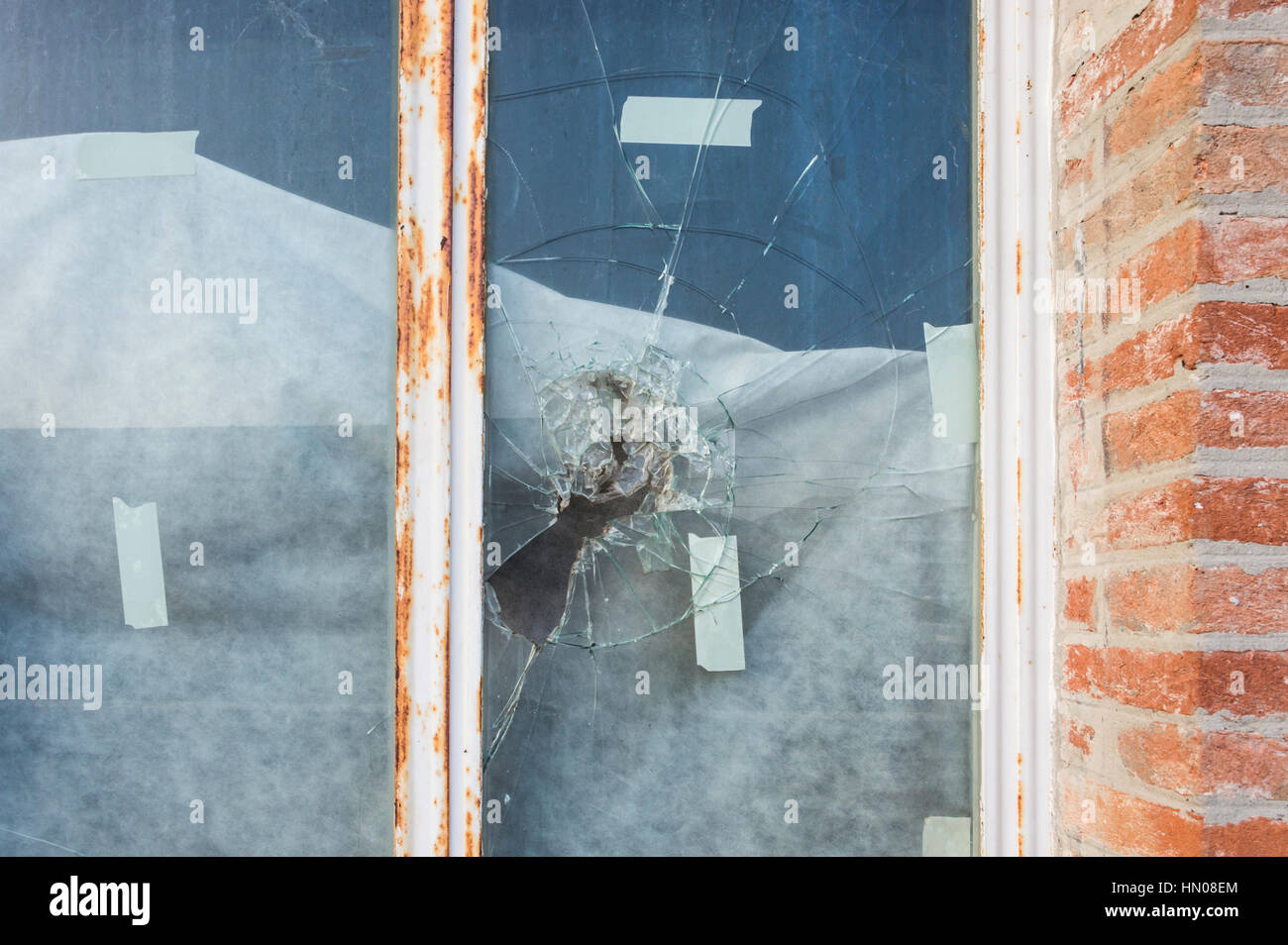 Accident cracked damaged broken house window glass Stock Photo - Alamy