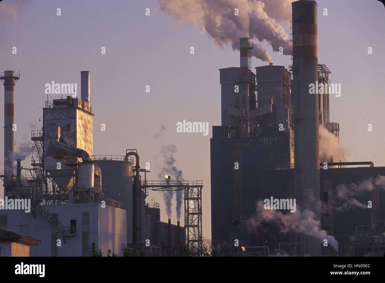 Paper factory blowing smoke and pollution into the air Stock Photo - Alamy