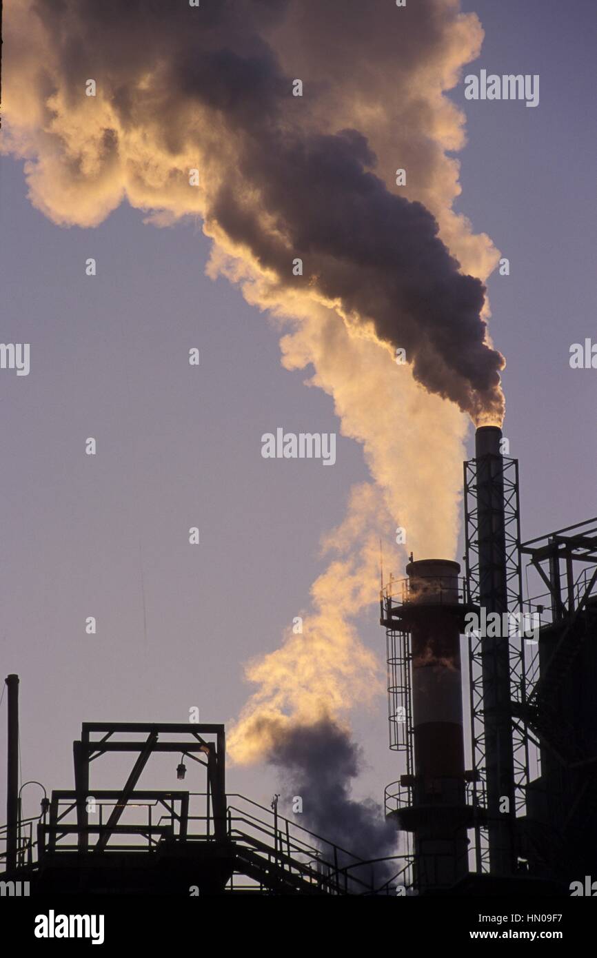 Paper factory blowing smoke and pollution into the air Stock Photo - Alamy