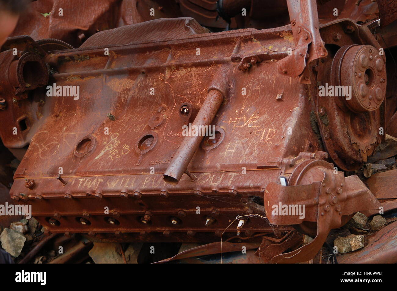 Rusted car engine inside an equally rusty car sitting on the hiking ...