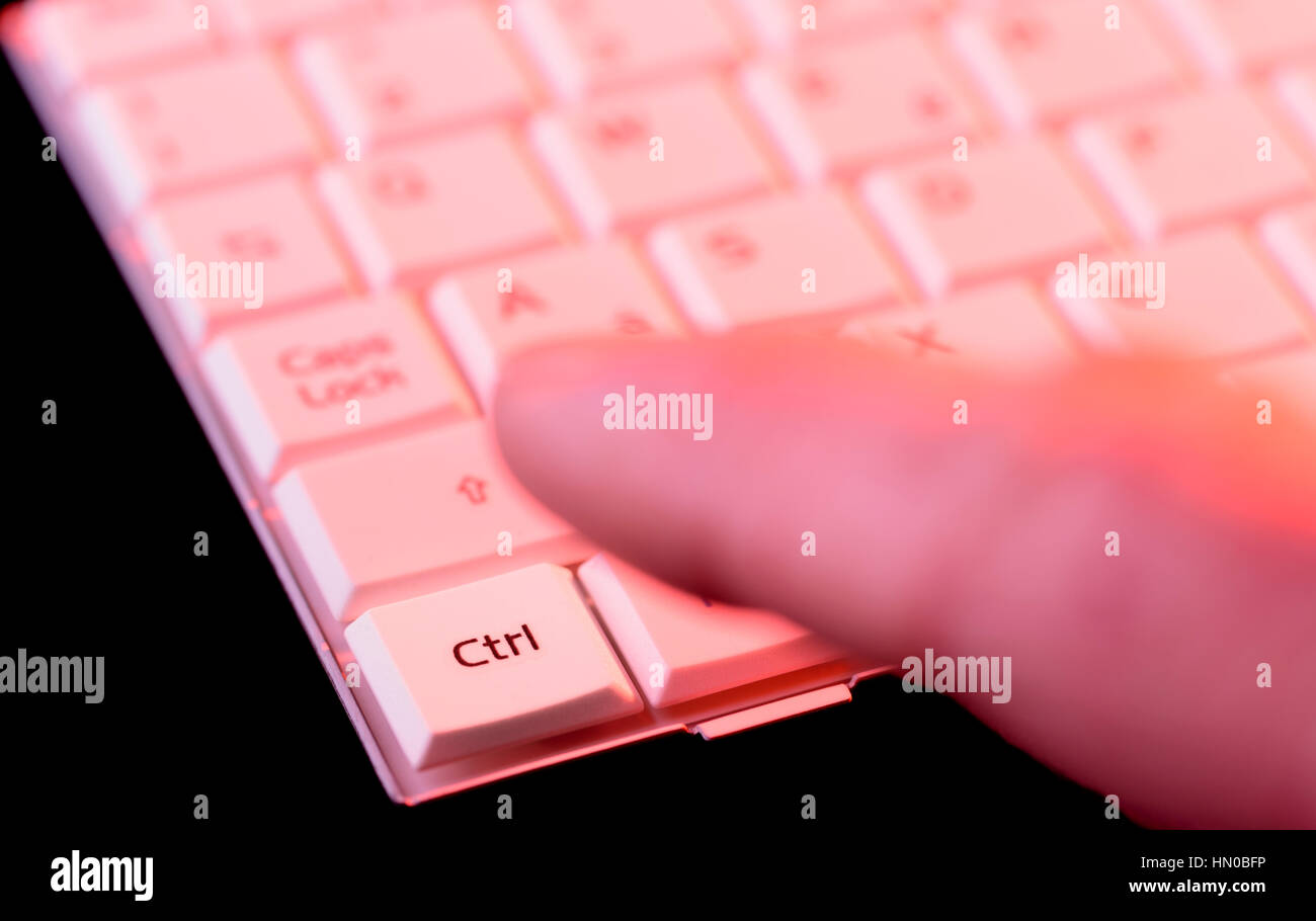 Finger striking the Cntrl button Stock Photo - Alamy
