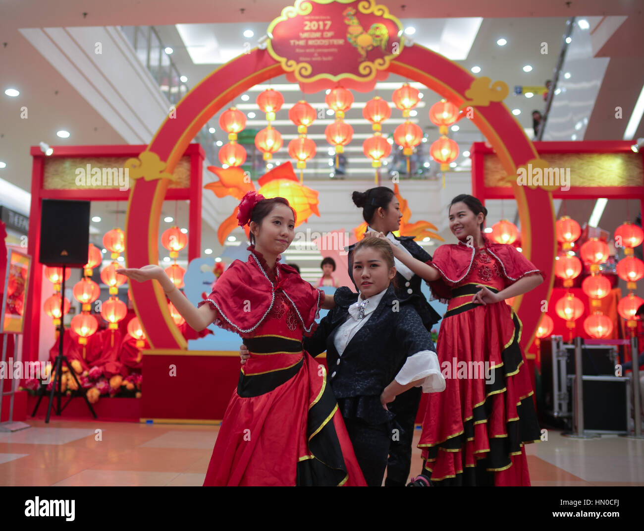 Chinese dancers performing at a shopping mall to enhance customers ...