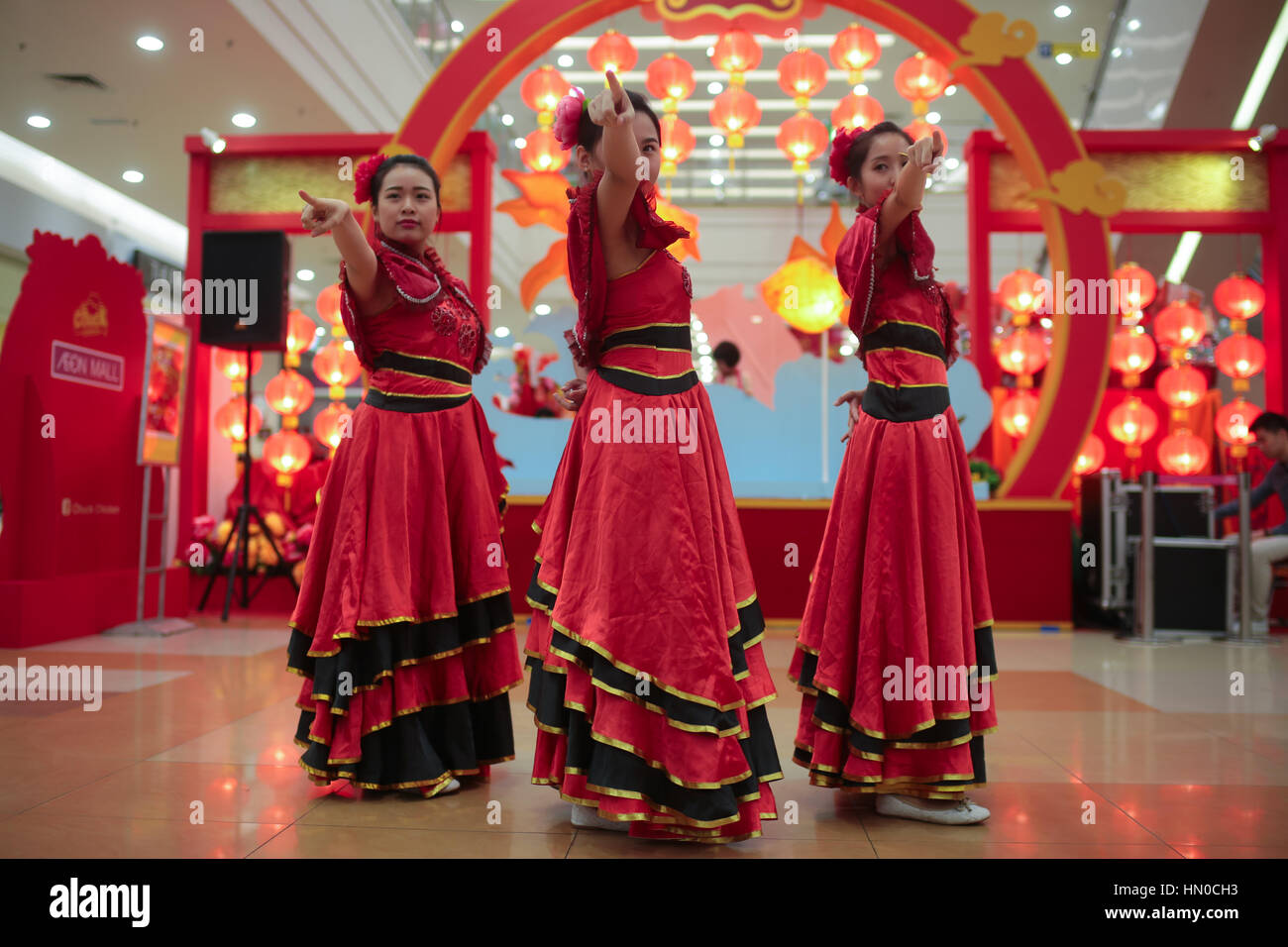 Chinese dancers performing at a shopping mall to enhance customers ...