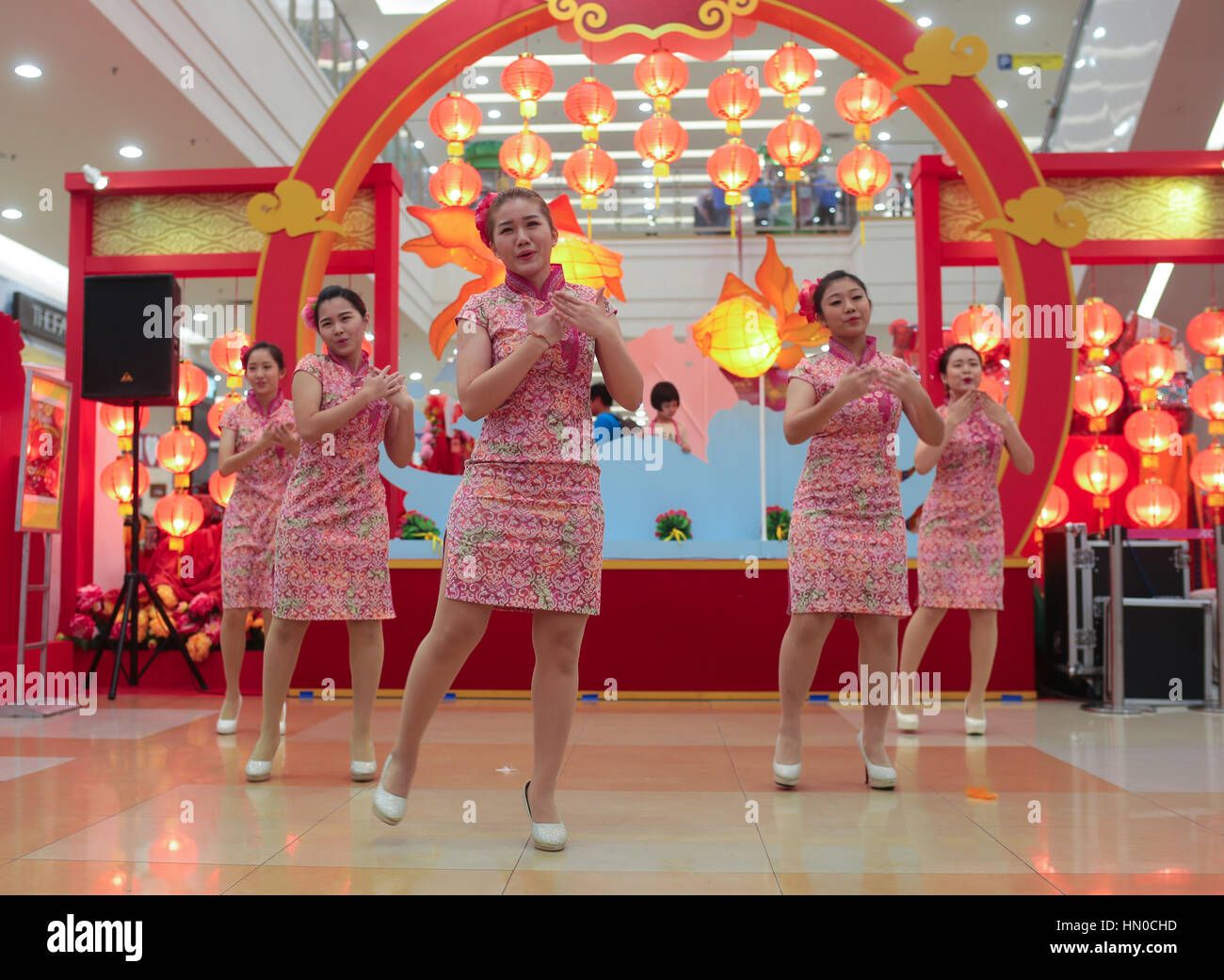 Chinese dancers performing at a shopping mall to enhance customers ...