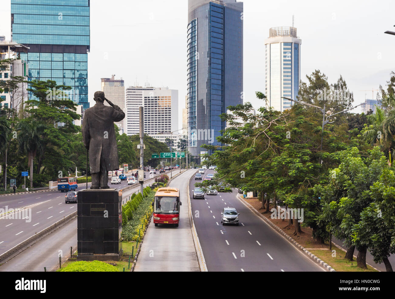 A transjakarta bus uses its dedicated traffic lane along Jalan Sudirman ...