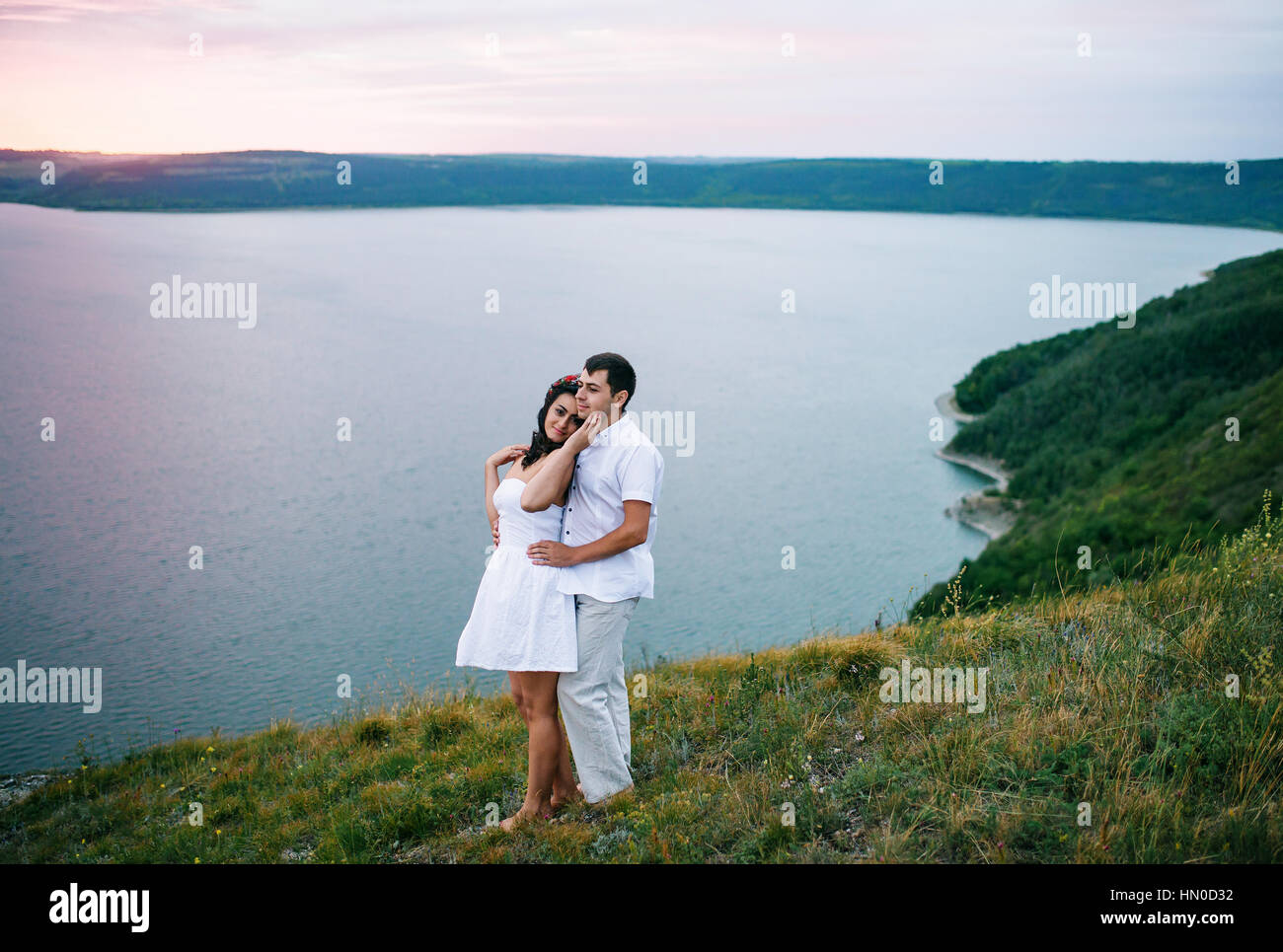 Loved couple in love at amazing landscape against cliff rocks Stock ...