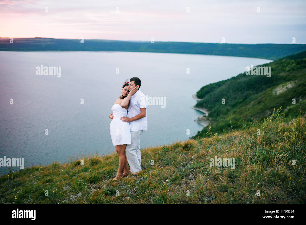 Loved couple in love at amazing landscape against cliff rocks Stock ...