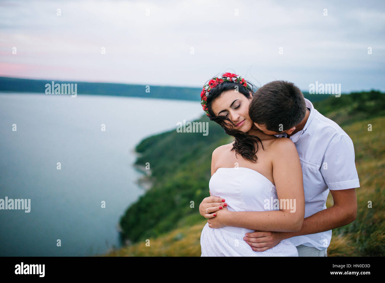 Loved couple in love at amazing landscape against cliff rocks Stock ...