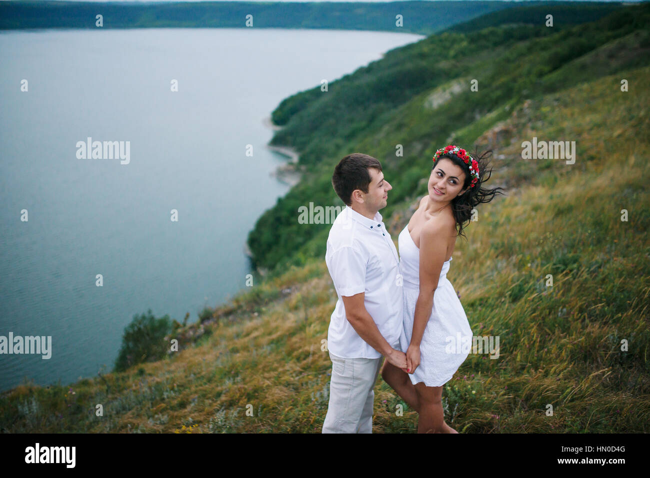 Loved couple in love at amazing landscape against cliff rocks Stock ...