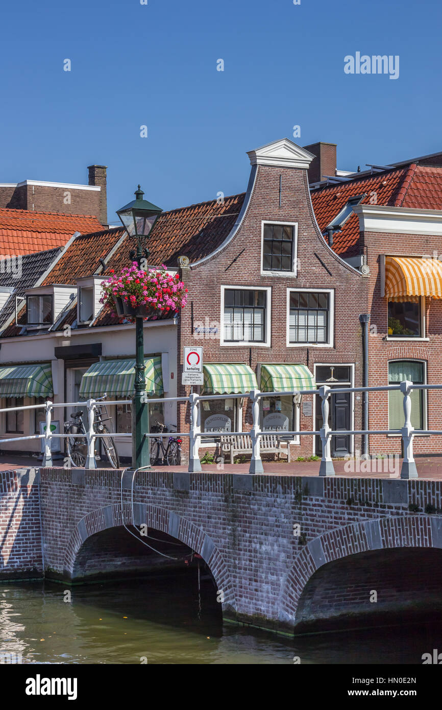 Canal, bridge and clock gable in the center of Alkmaar, Netherlands ...