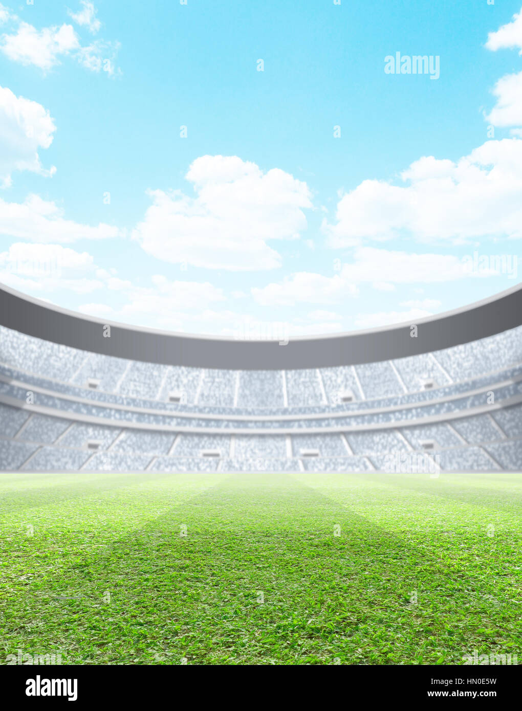 A generic seated stadium with a green grass pitch in the day time under ...