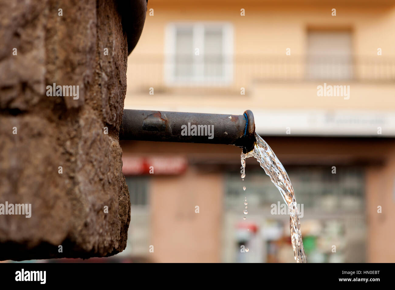 Water falling by Source pipe with crystal clear water of the mountain ...