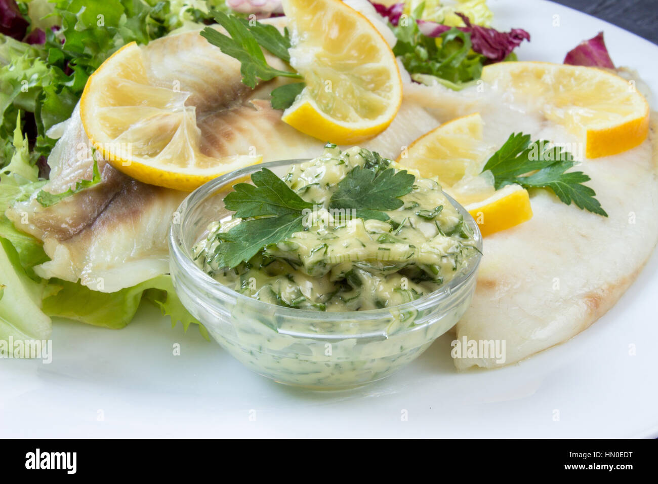 steamed tilapia fish with salad and tartar sauce Stock Photo - Alamy
