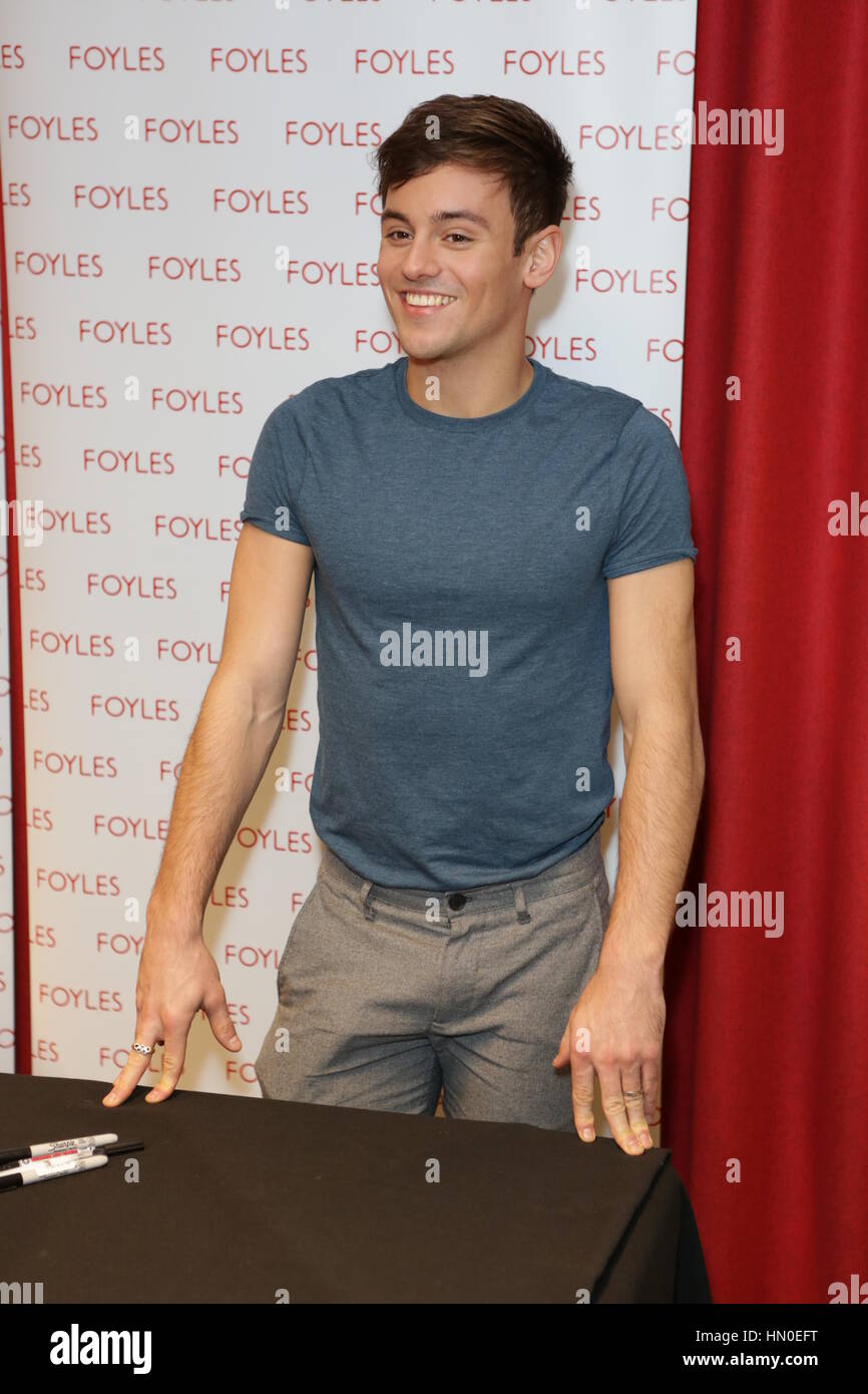 Gold medal-winning British diver Tom Daley, signs copies of his new ...