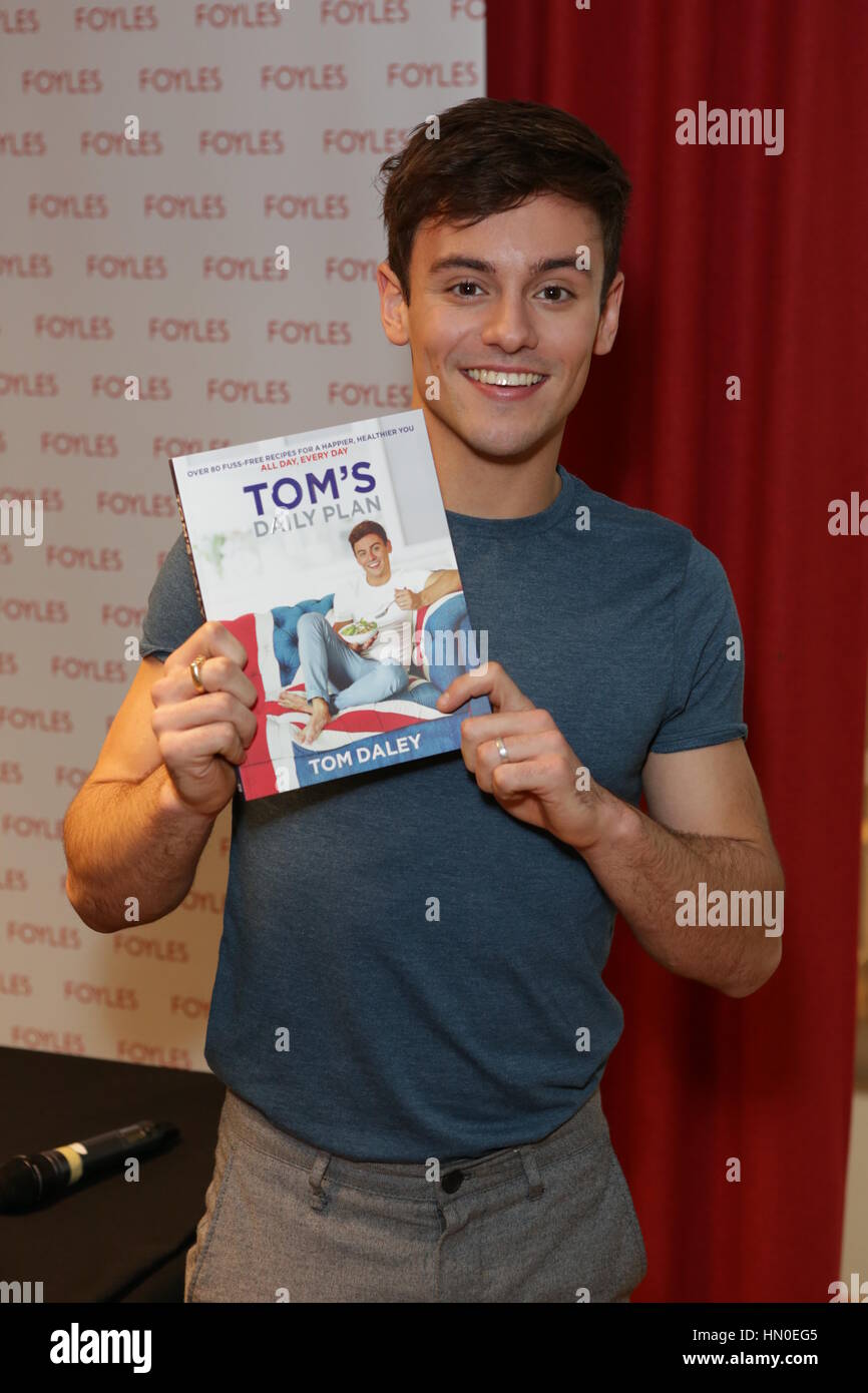 Gold medal-winning British diver Tom Daley, signs copies of his new ...