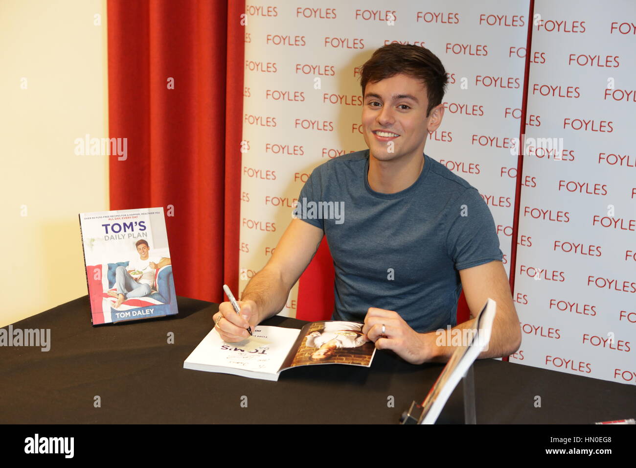 Gold medal-winning British diver Tom Daley, signs copies of his new ...