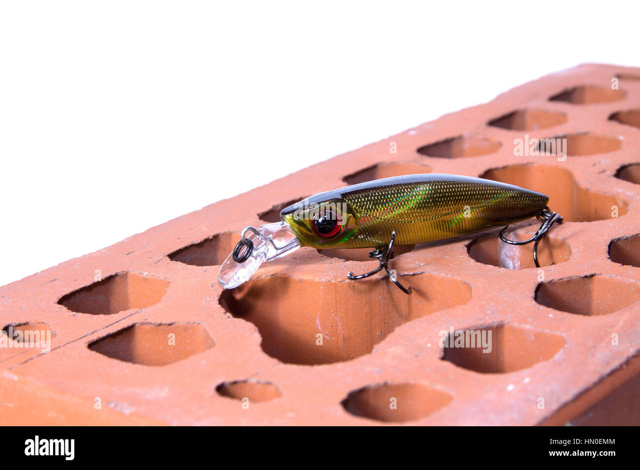 Lure for bricks. Bait on a brick background Stock Photo - Alamy