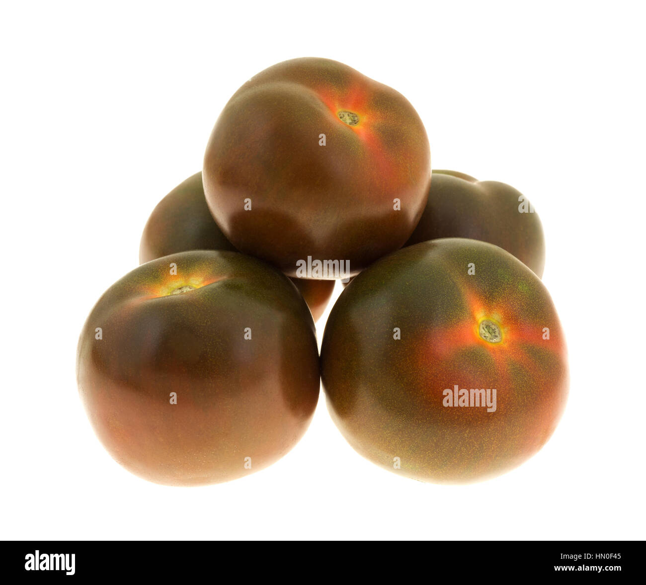 A group of a ripe brown tomatoes isolated on a white background Stock ...