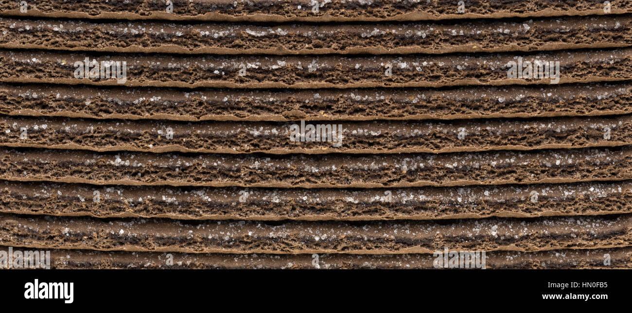 Close side view of a stack of chocolate graham crackers Stock Photo - Alamy