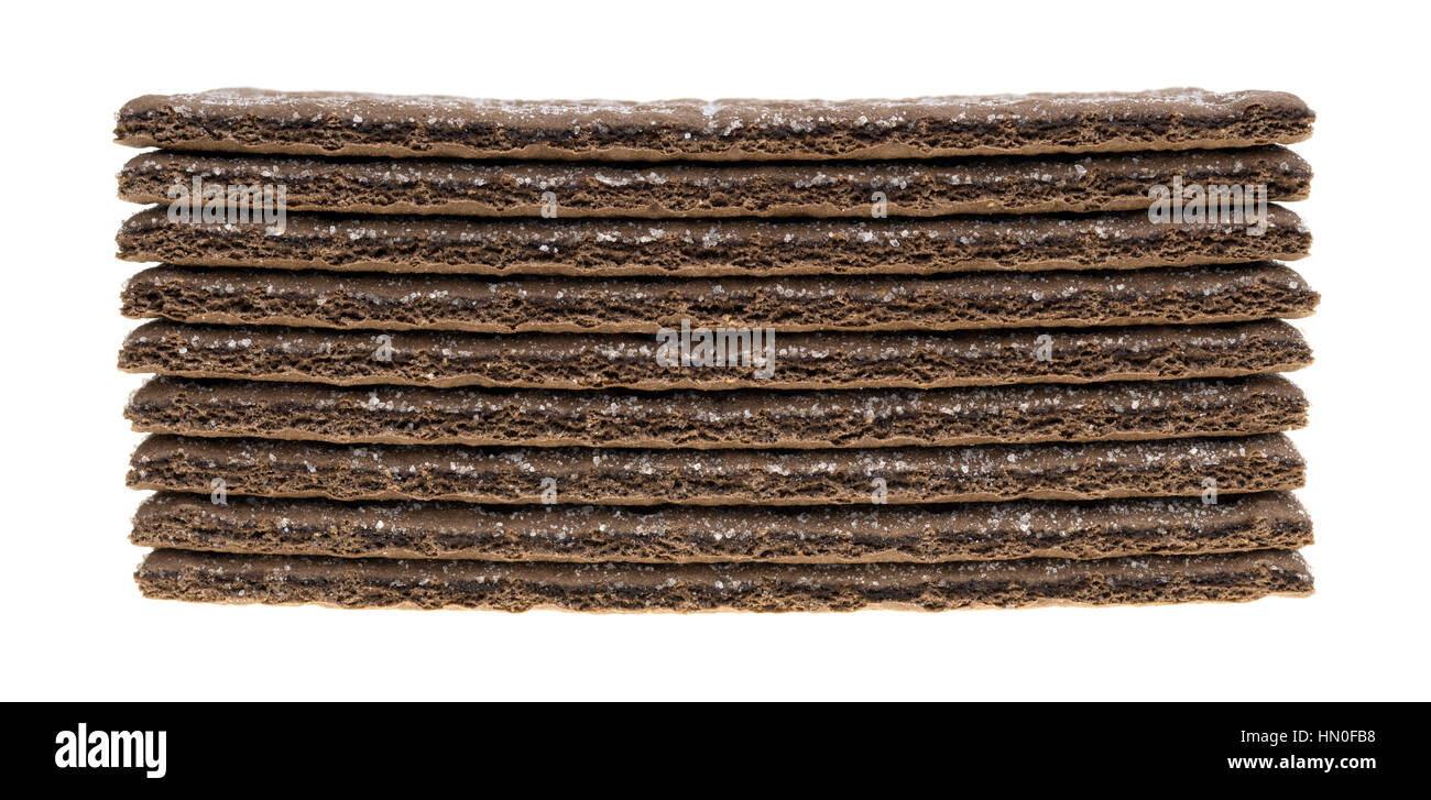 A large stack of chocolate graham crackers isolated on a white ...