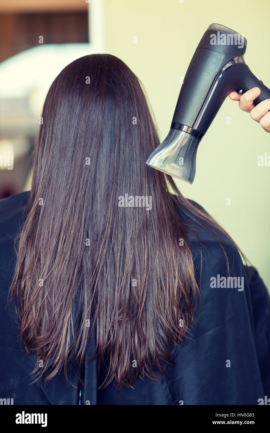 stylist hand with fan dries woman hair at salon Stock Photo - Alamy