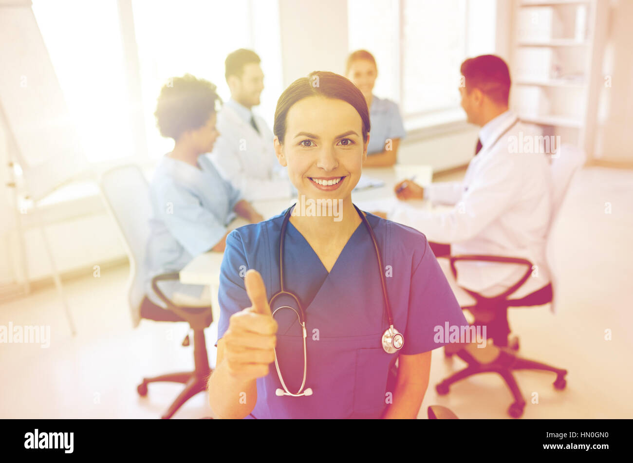 happy doctor over group of medics at hospital Stock Photo - Alamy