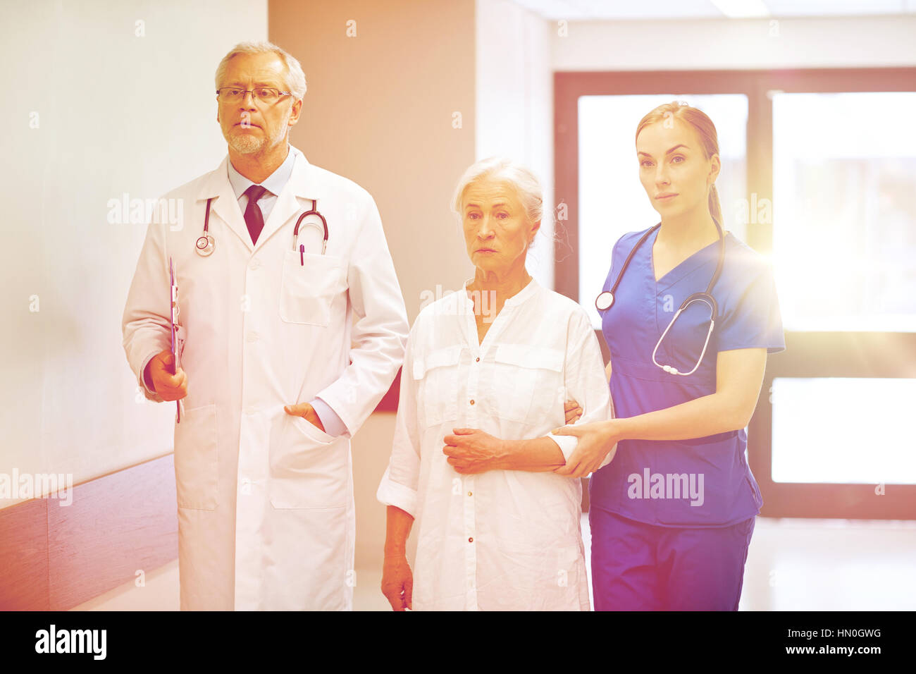 medics and senior patient woman at hospital Stock Photo - Alamy