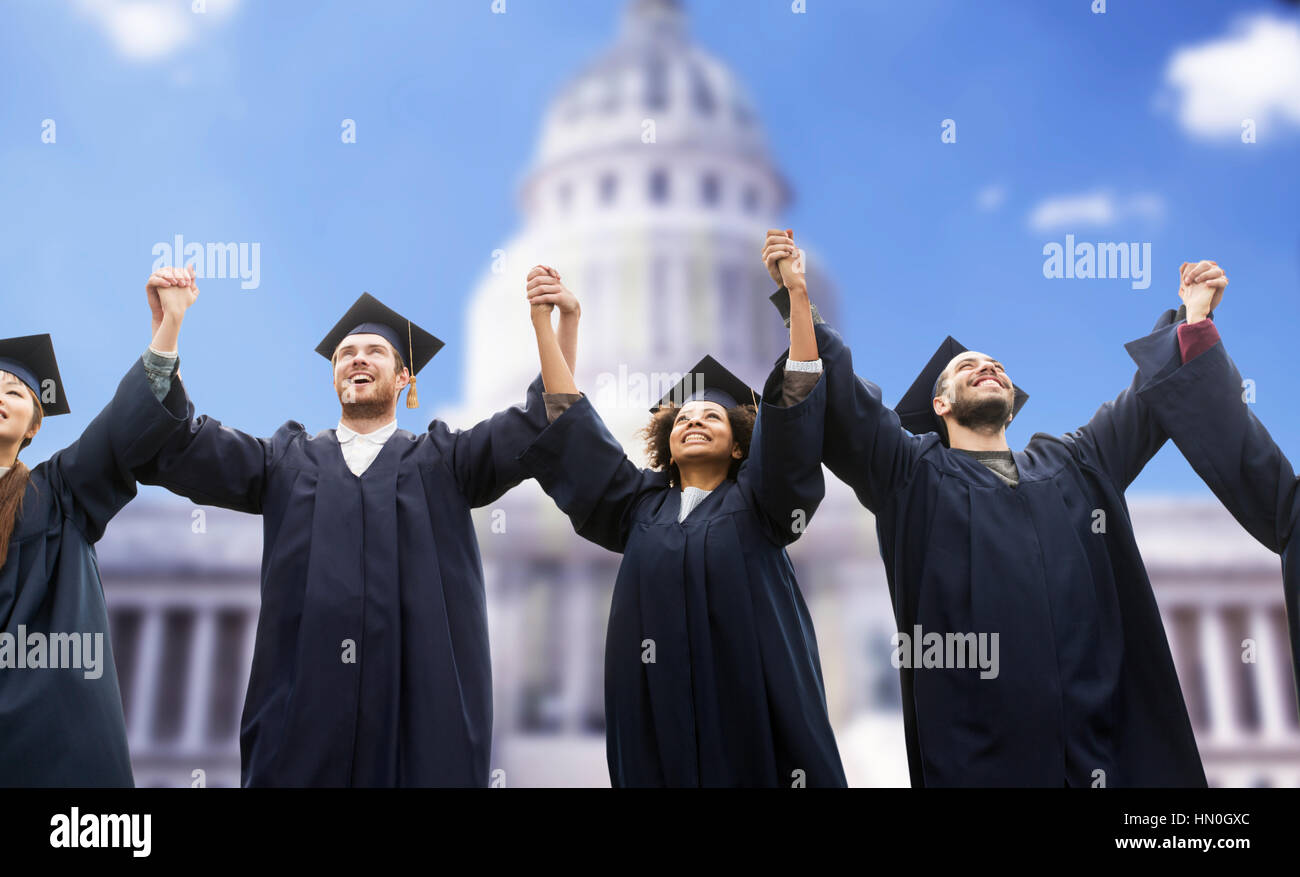 happy students or bachelors celebrating graduation Stock Photo - Alamy