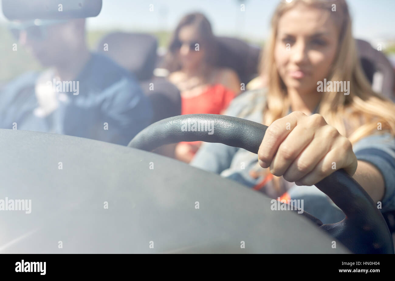 happy friends driving in convertible car Stock Photo - Alamy