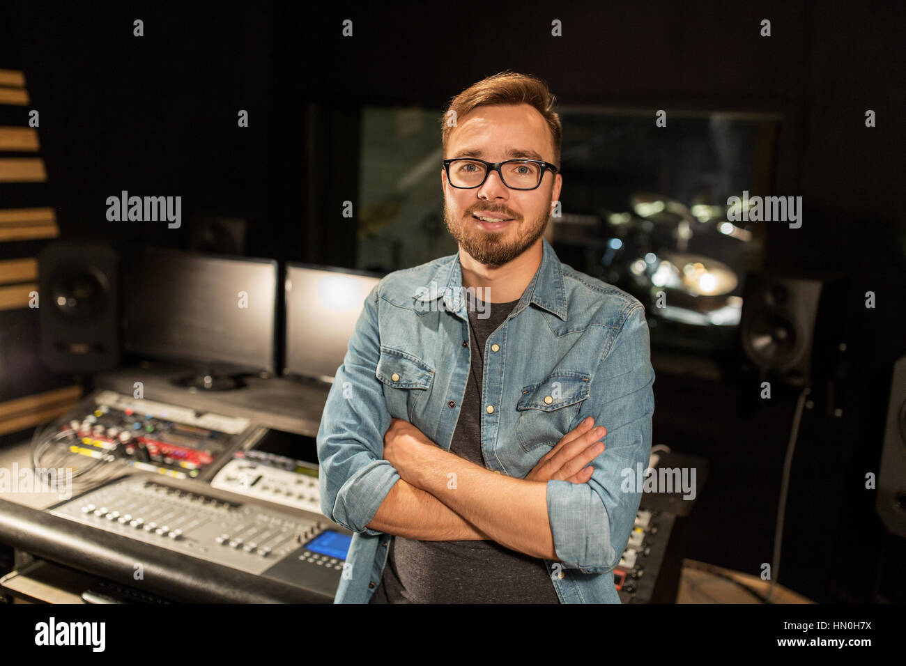 man at mixing console in music recording studio Stock Photo - Alamy
