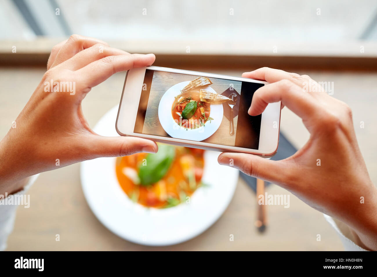 hands with smartphone photographing food Stock Photo - Alamy