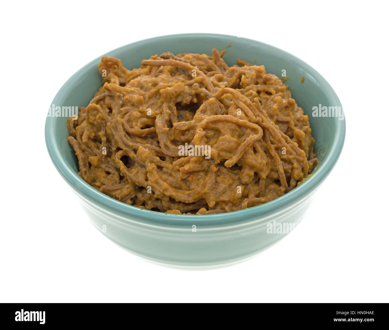 A serving of soybean spaghetti with tomato sauce in a green bowl ...