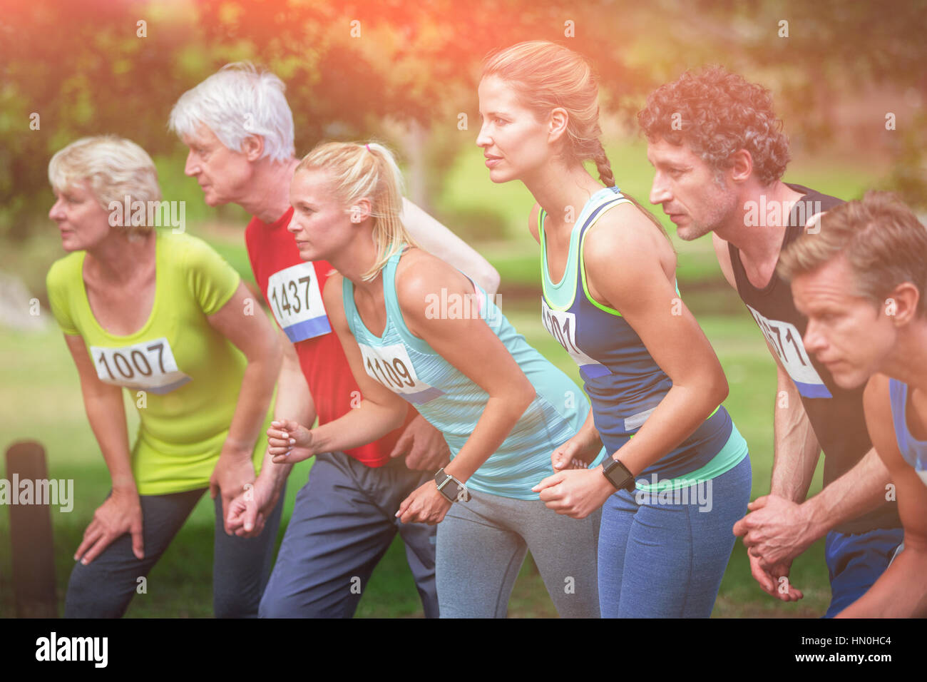 Marathon athletes on the starting line in park Stock Photo - Alamy