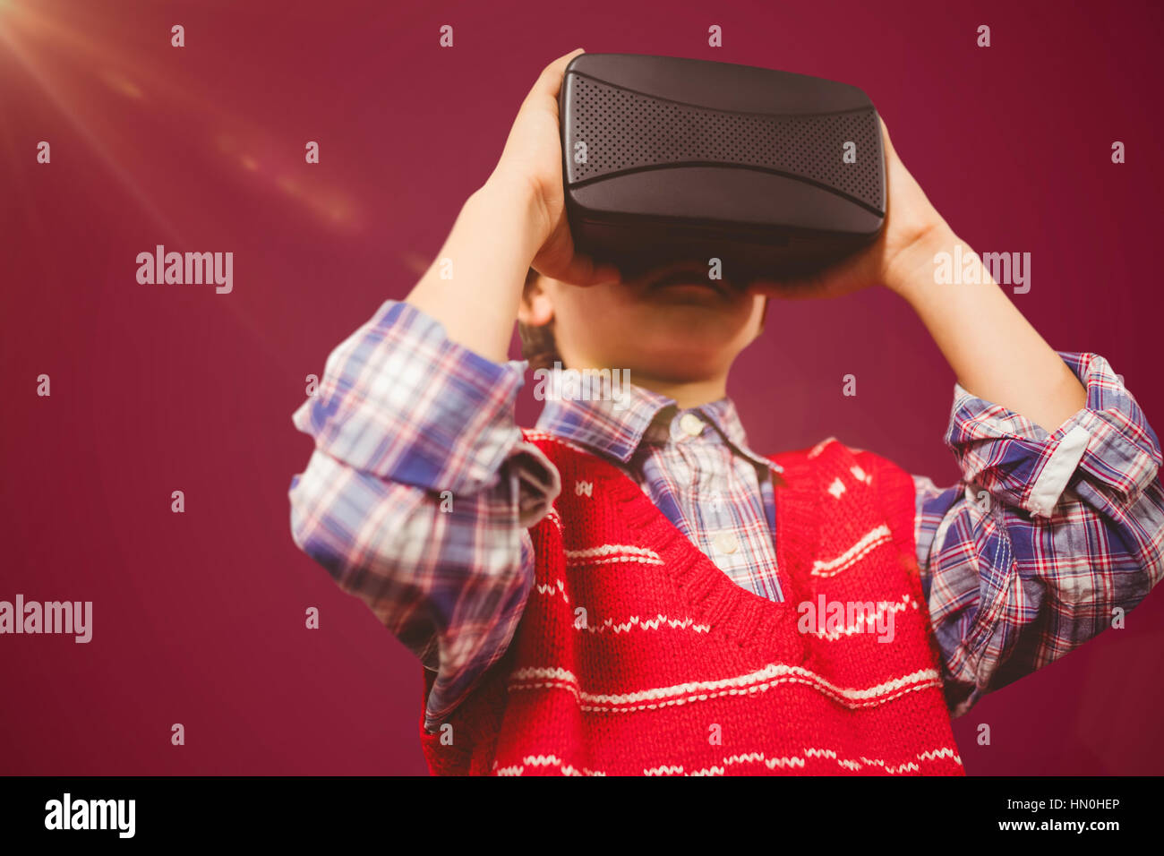 Children using an oculus against red background Stock Photo - Alamy