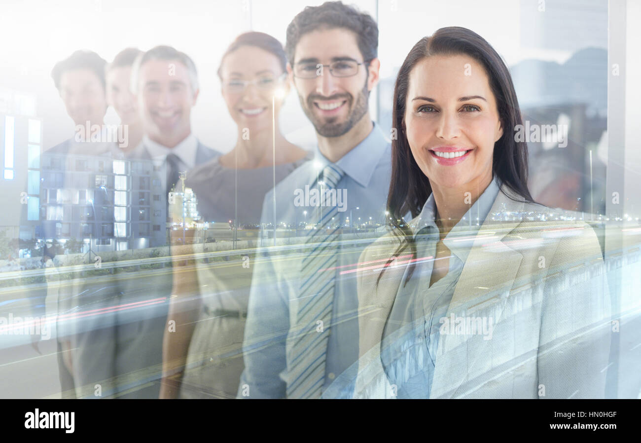 Smiling employees in a line at work Stock Photo - Alamy