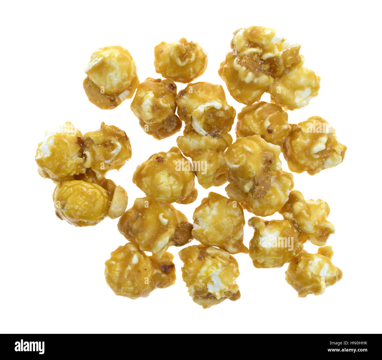 Top view of a portion of toffee caramel popcorn with nuts isolated on a ...