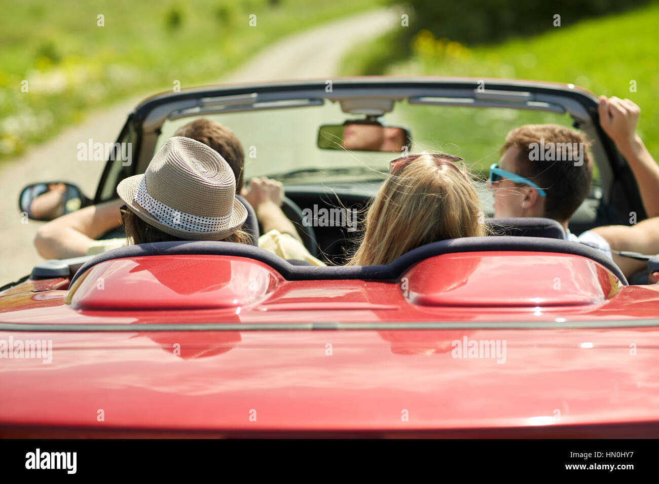 happy friends driving in convertible car at summer Stock Photo - Alamy