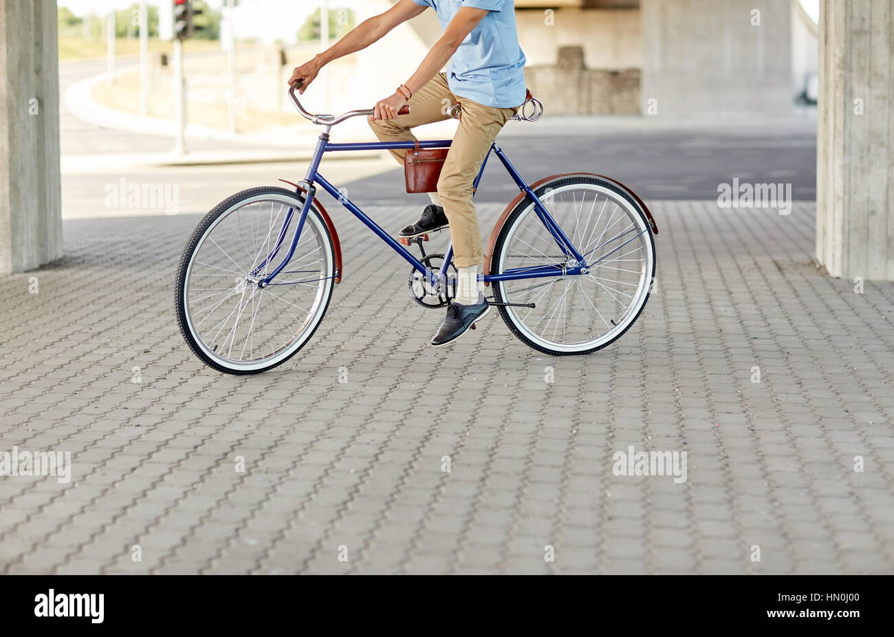Man ride bike pavement hi-res stock photography and images - Alamy