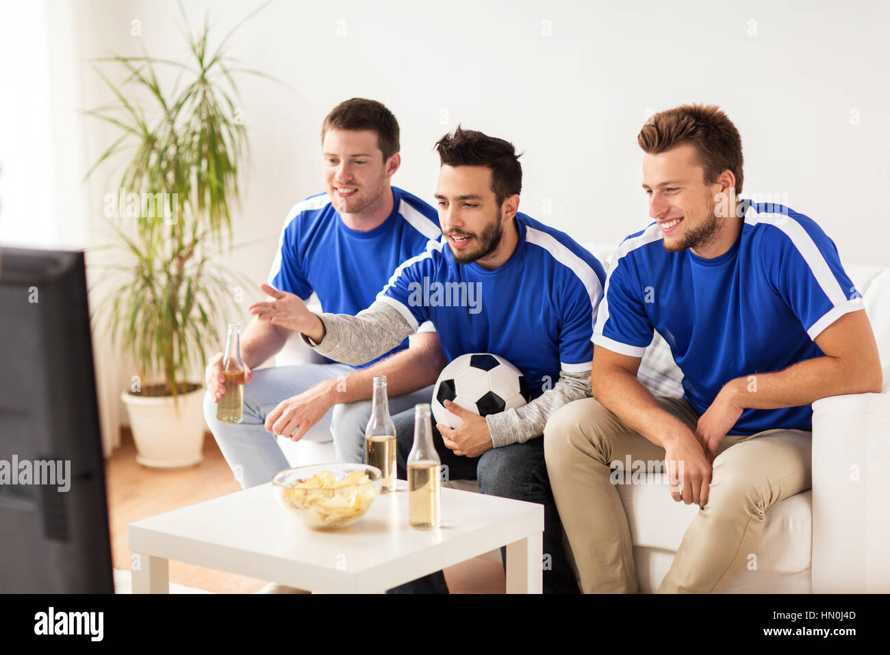 friends or football fans watching soccer at home Stock Photo - Alamy