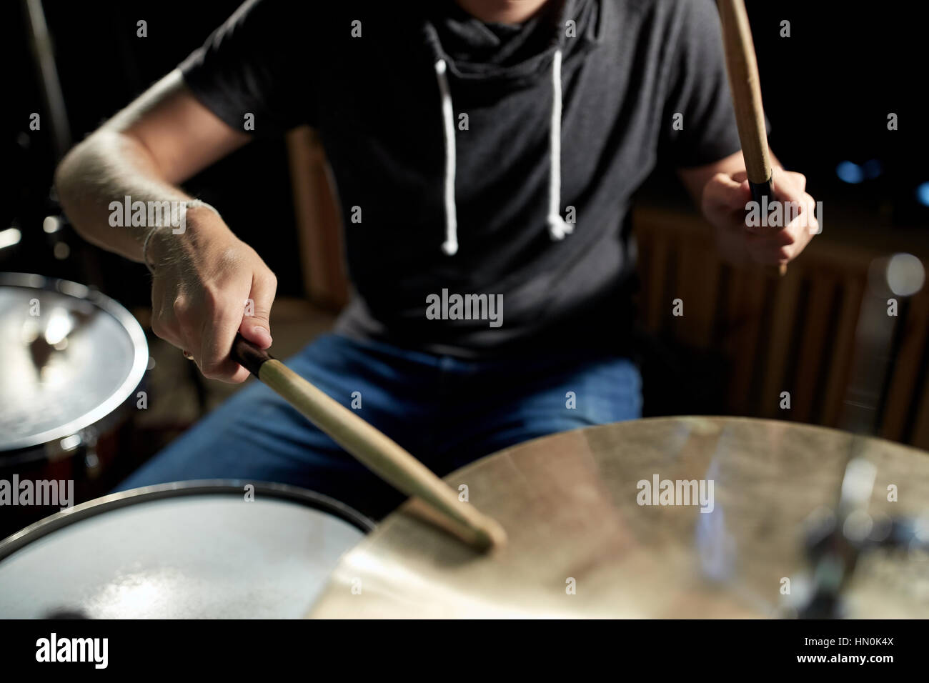 male musician playing drums and cymbals at concert Stock Photo - Alamy