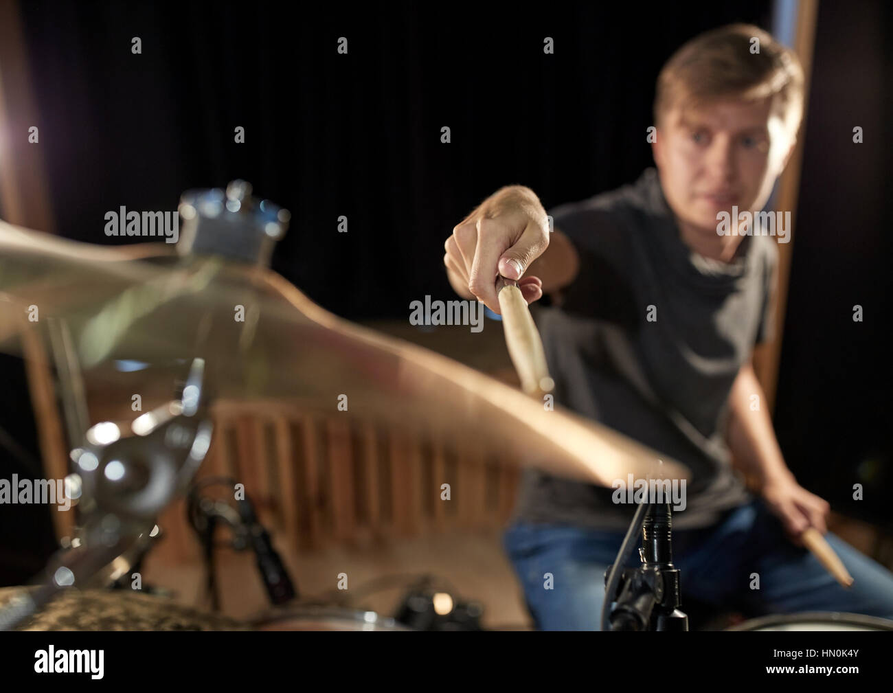 male musician playing drums and cymbals at concert Stock Photo - Alamy