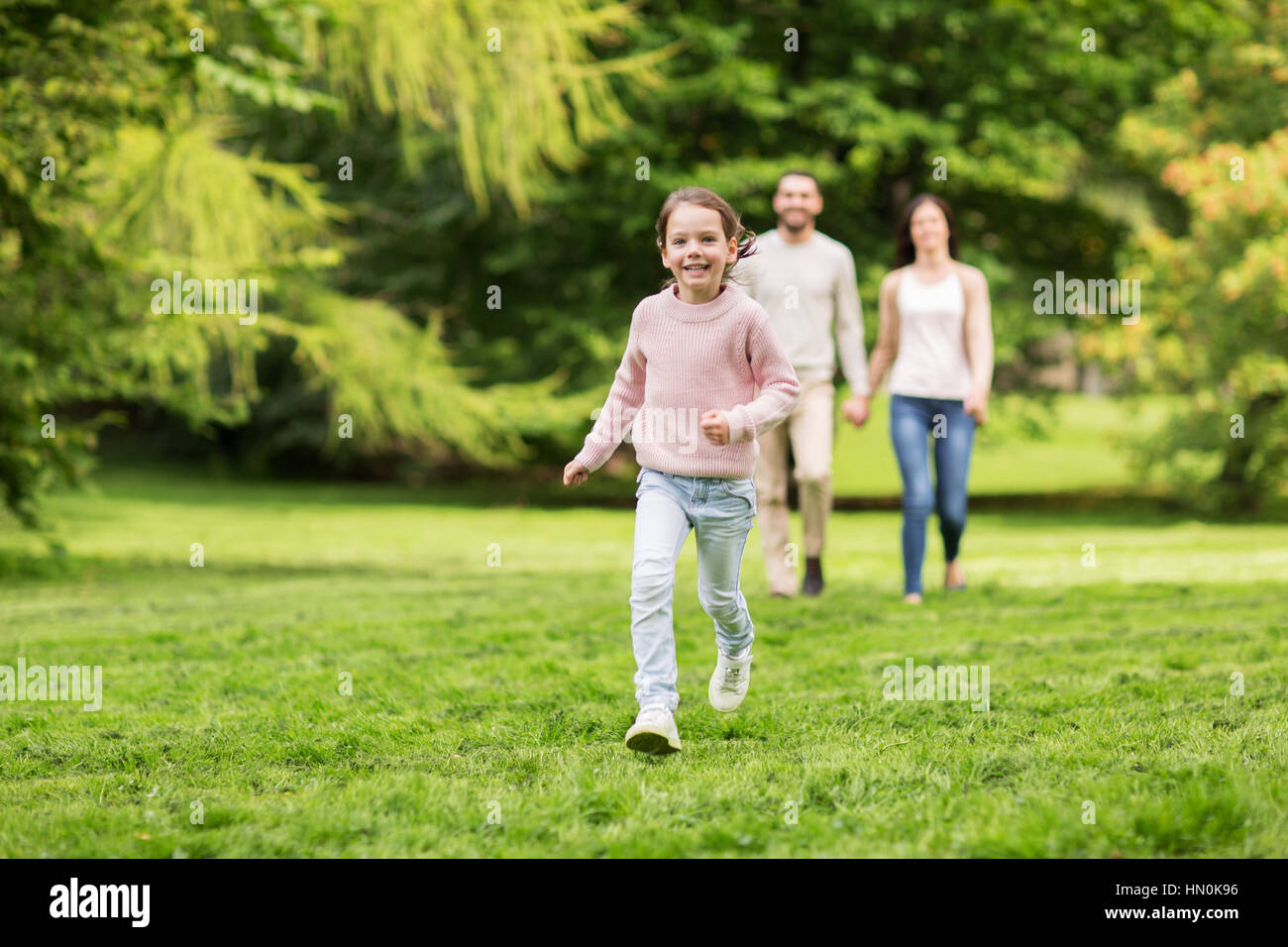 happy family walking in summer park and having fun Stock Photo - Alamy