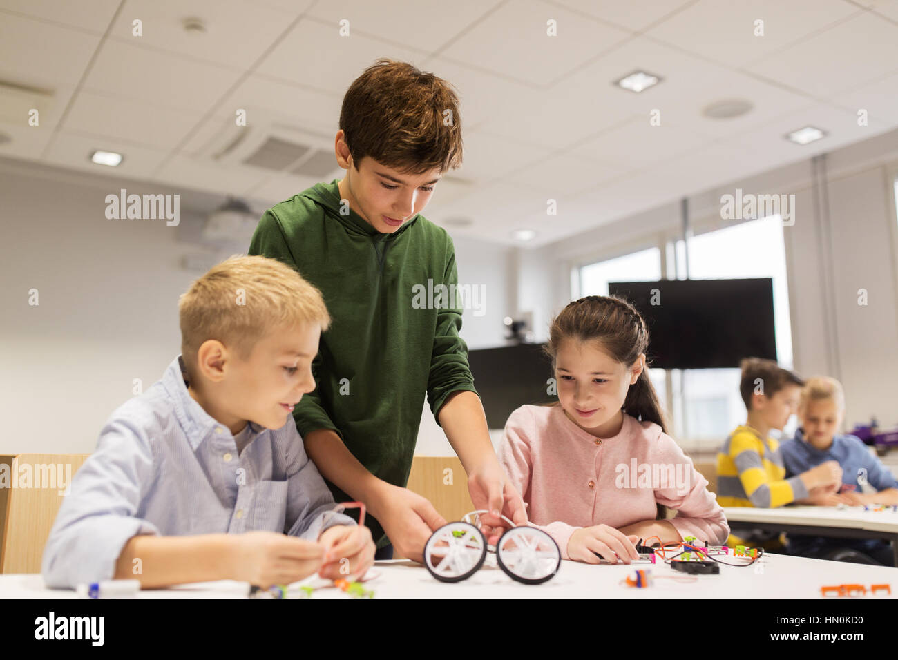 happy children building robots at robotics school Stock Photo - Alamy