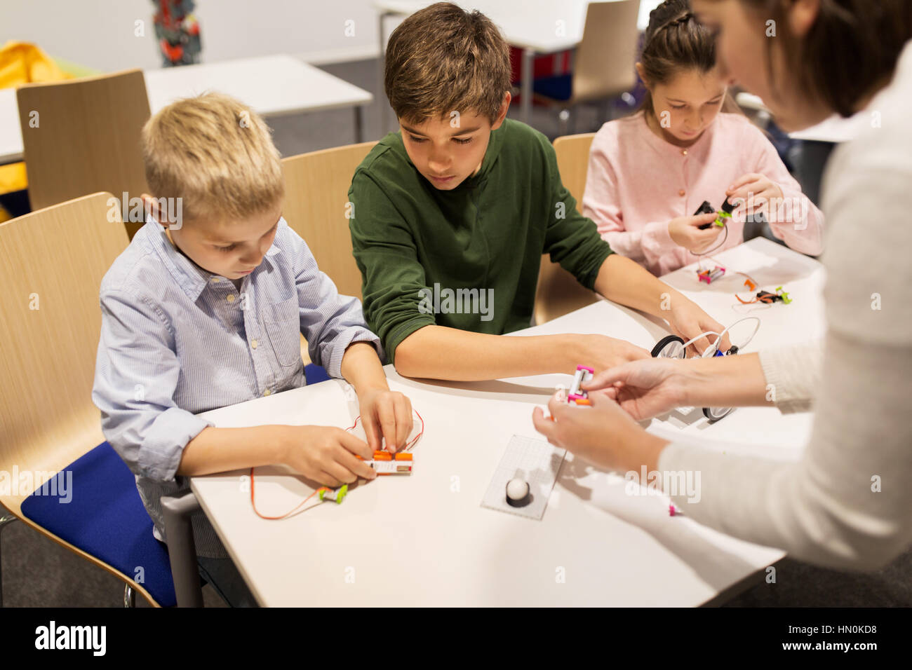 happy children building robots at robotics school Stock Photo - Alamy