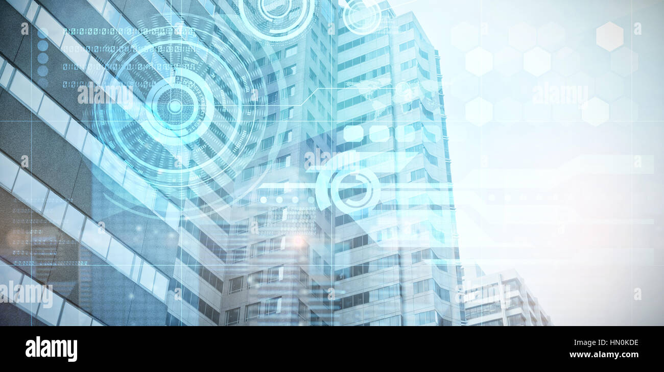 View of modern office building against futuristic technology interface ...