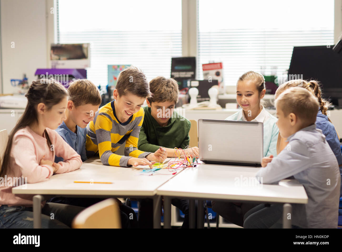 happy children with laptop at robotics school Stock Photo - Alamy
