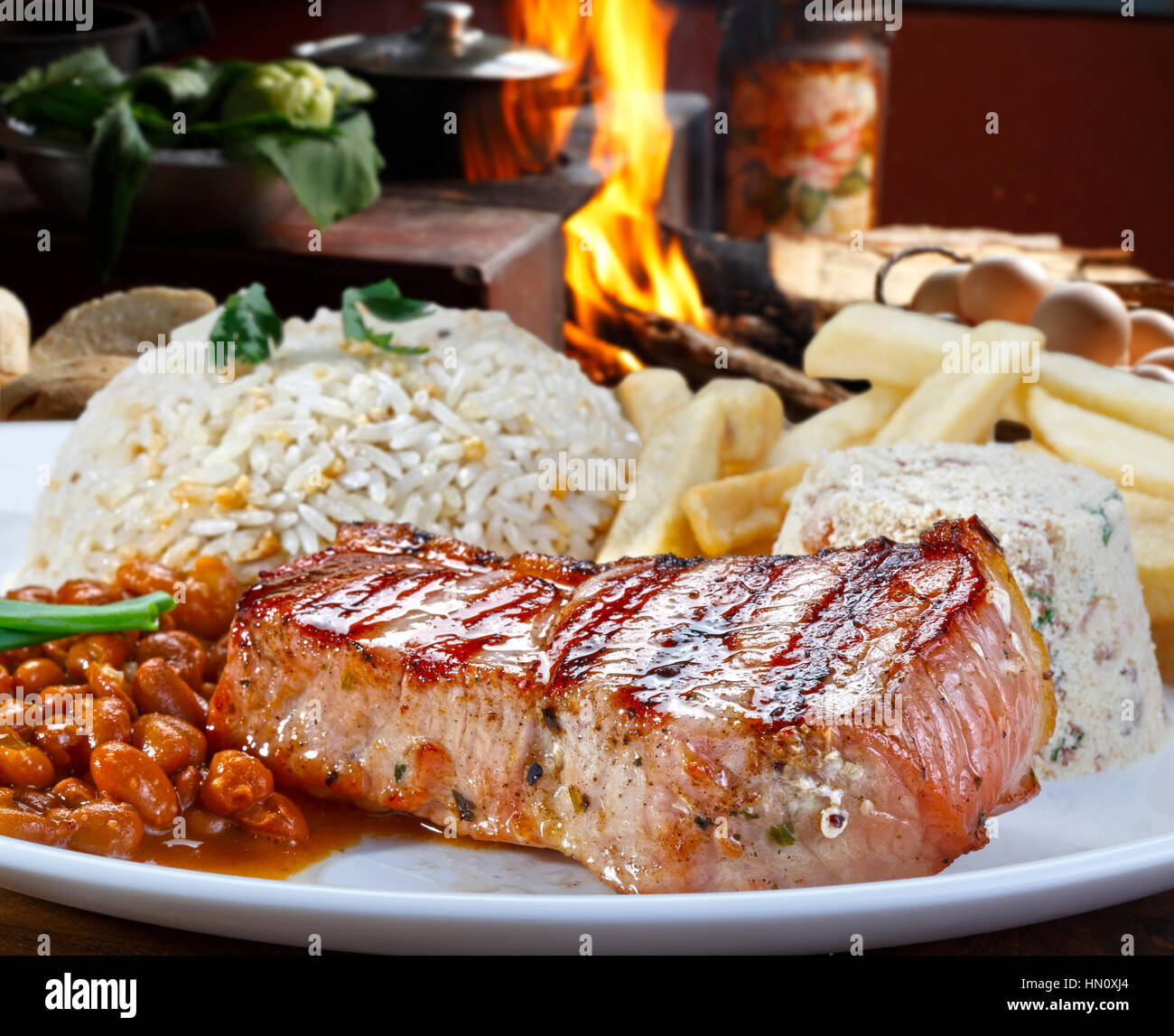 Grilled pork with fries and vegetables Stock Photo - Alamy