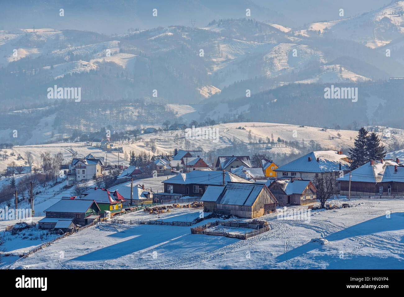 Countryside landscape with traditional Romanian village in the valleys ...
