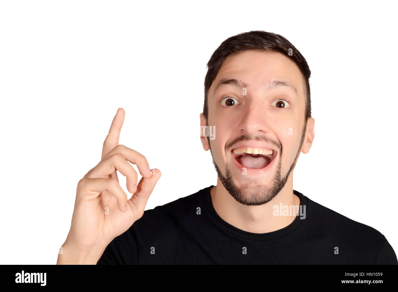 Portrait of attractive young man pointing up surprised. Isolated white ...