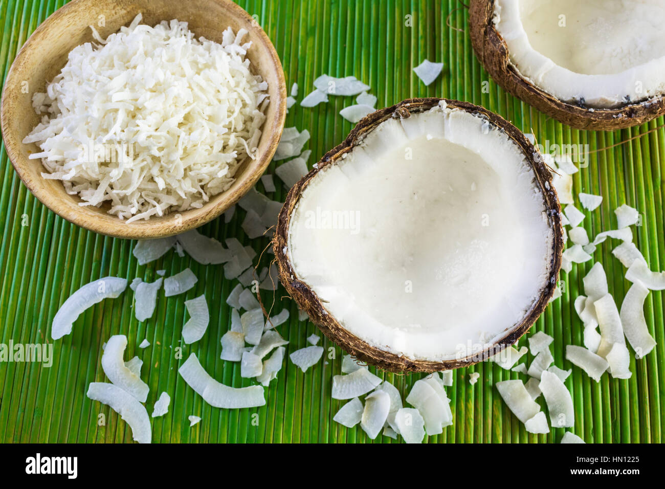 Dehydrated coconut flakes in wooden bowl Stock Photo - Alamy